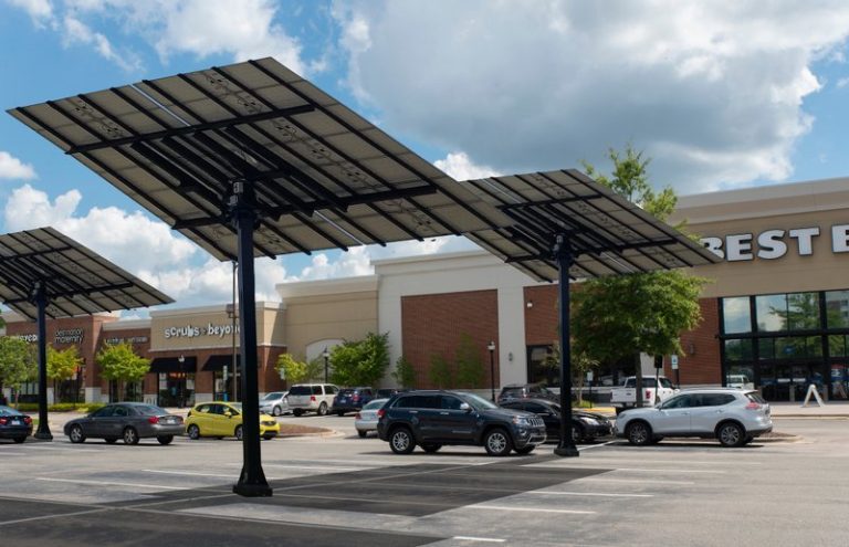 Solarizing parking lots with solar carports or elevated solar trackers
